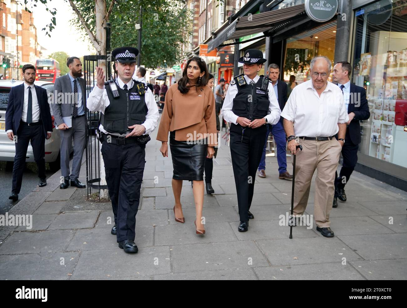 Home Secretary, Suella Braverman is accompanied by Metropolitan Police ...
