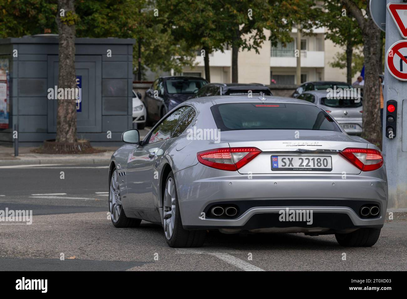 Grey Maserati GranTurismo stopped at a red light Stock Photo - Alamy