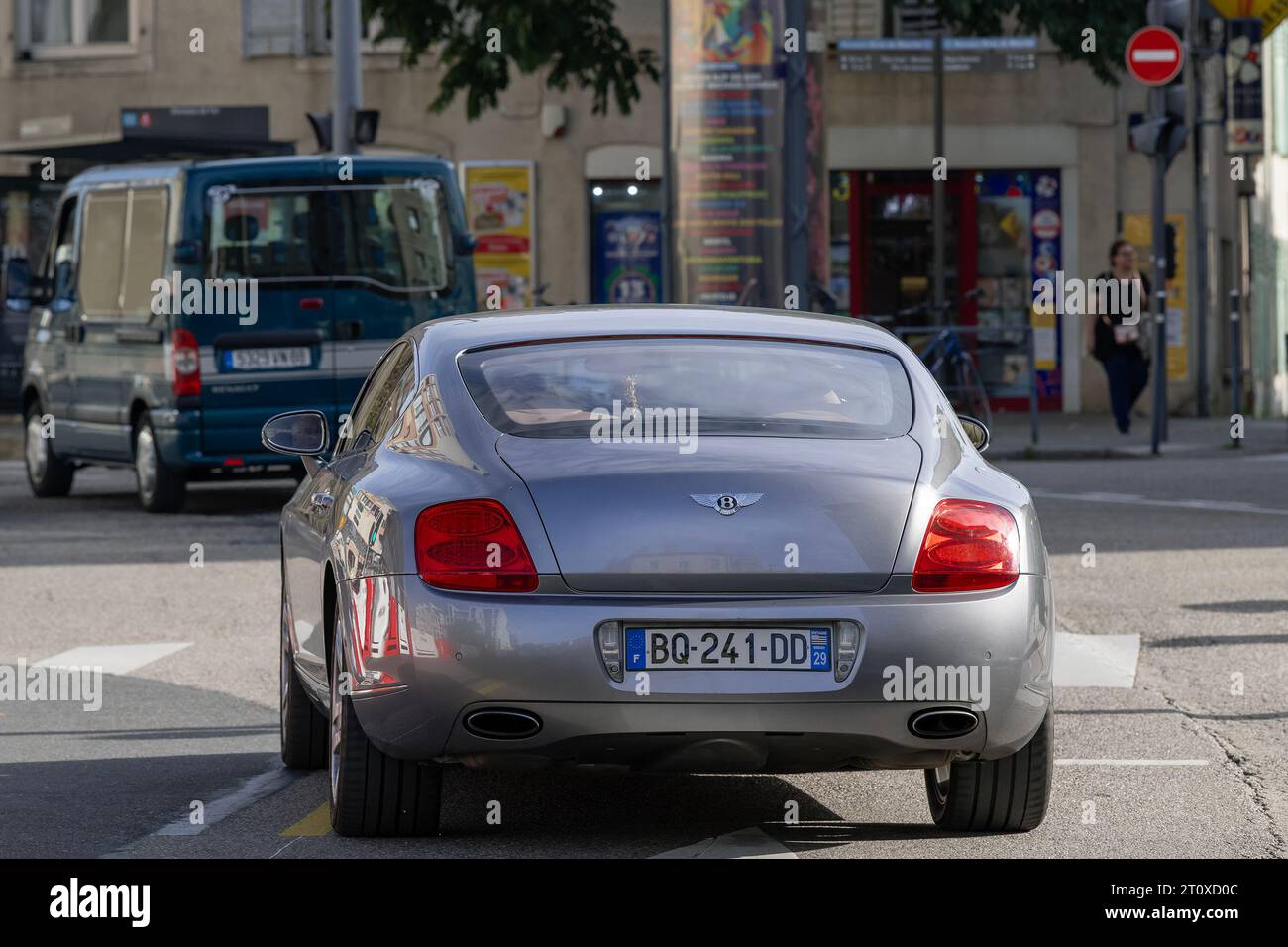 Grey Bentley Continental GT driving on the road Stock Photo - Alamy