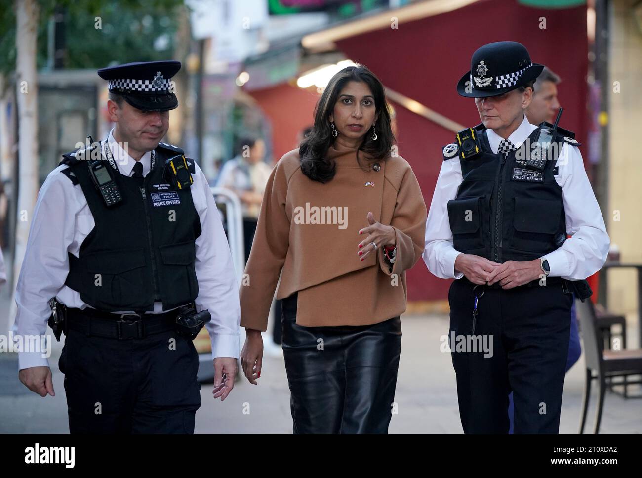 Home Secretary, Suella Braverman is accompanied by Metropolitan Police ...
