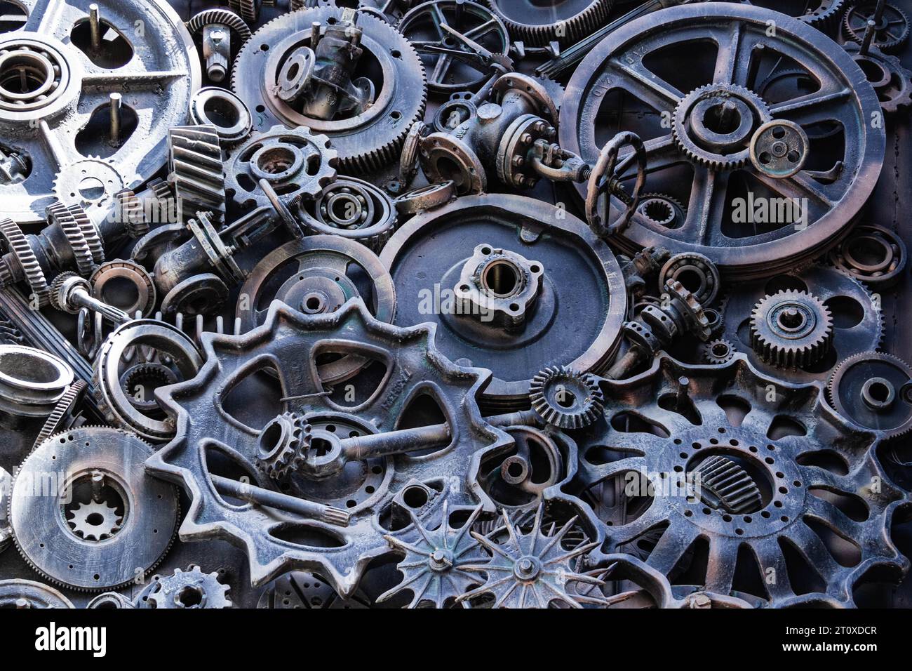 Metal gears background. Old and rusty spare parts for industrial ...
