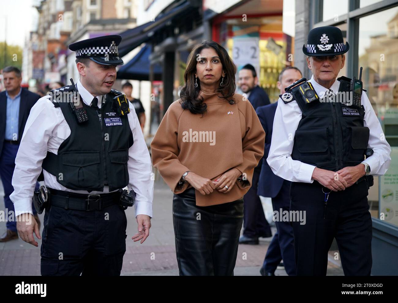 Home Secretary, Suella Braverman is accompanied by Metropolitan Police ...