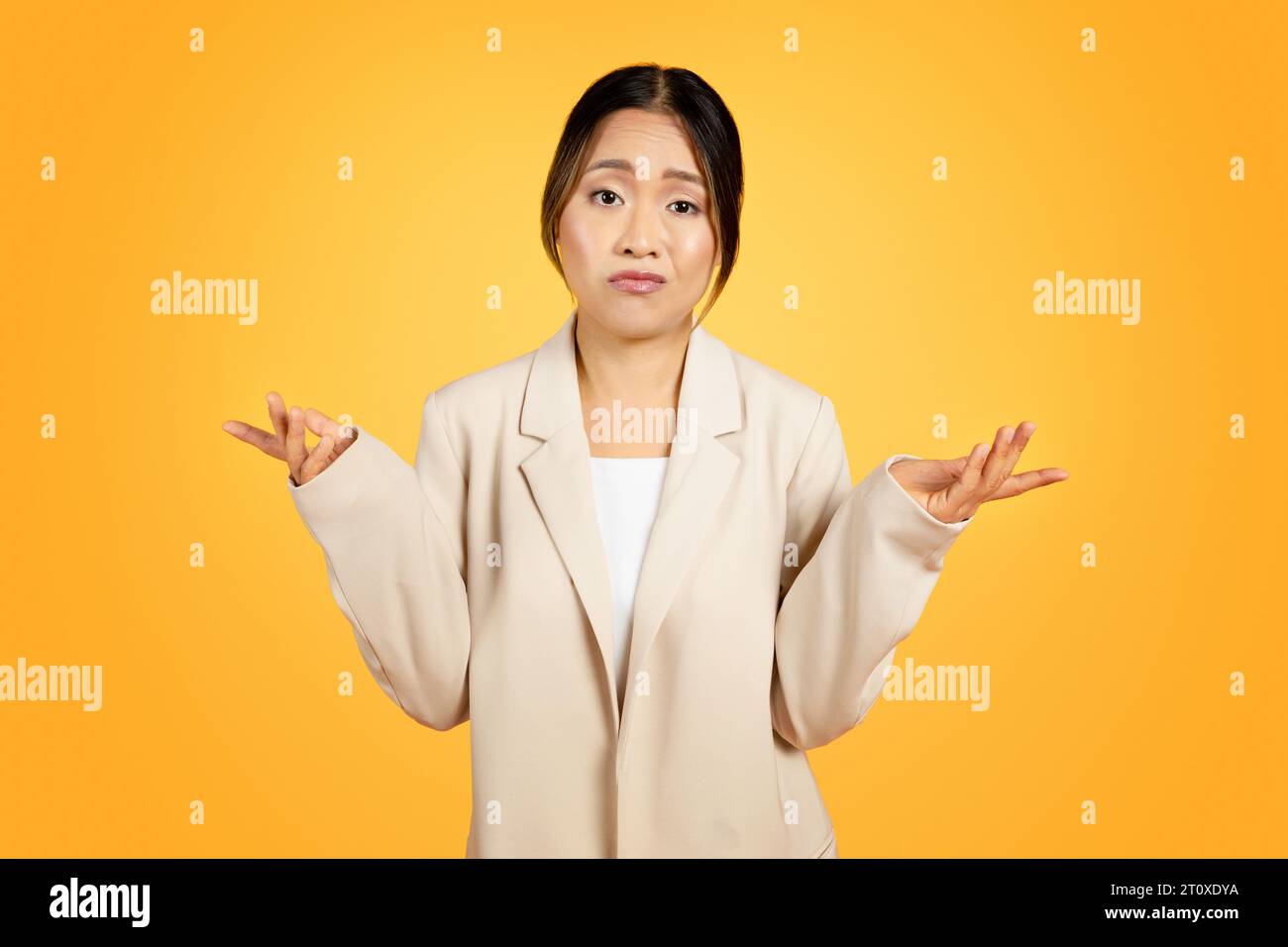 Confused Asian millennial woman, in deep thought, facing a perplexing ...