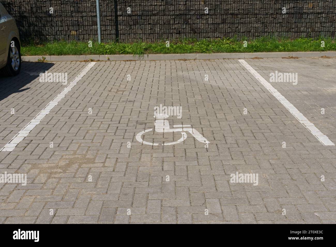 Special parking space for a car driven by a disabled person. Road ...