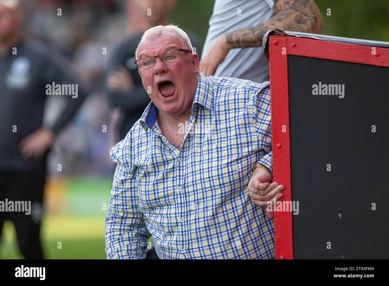 Football manager Steve Evans on touchline during match whilst head ...