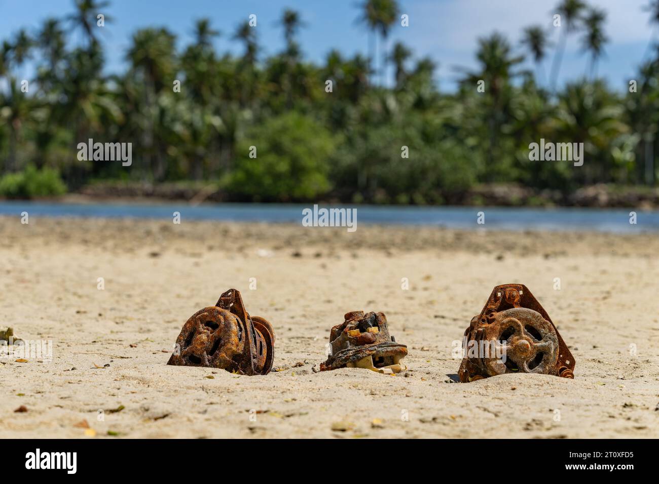 Old iron encrusted and rusty engine parts on beach in Fiji Stock Photo ...
