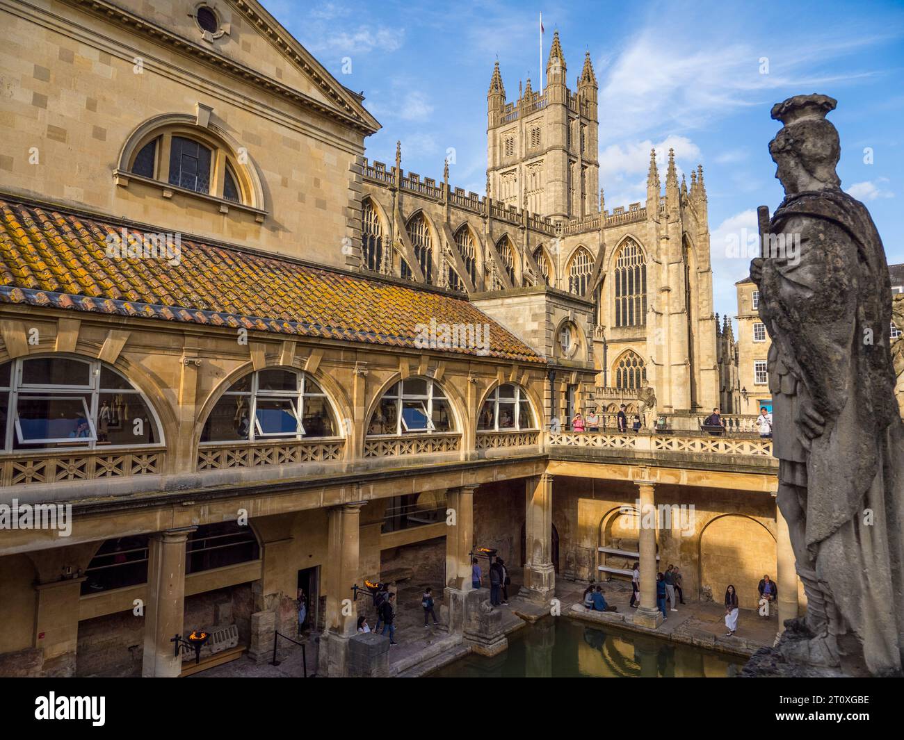 Statue of Roman Solider, at the Roman Baths, with view of Bath Abbey ...