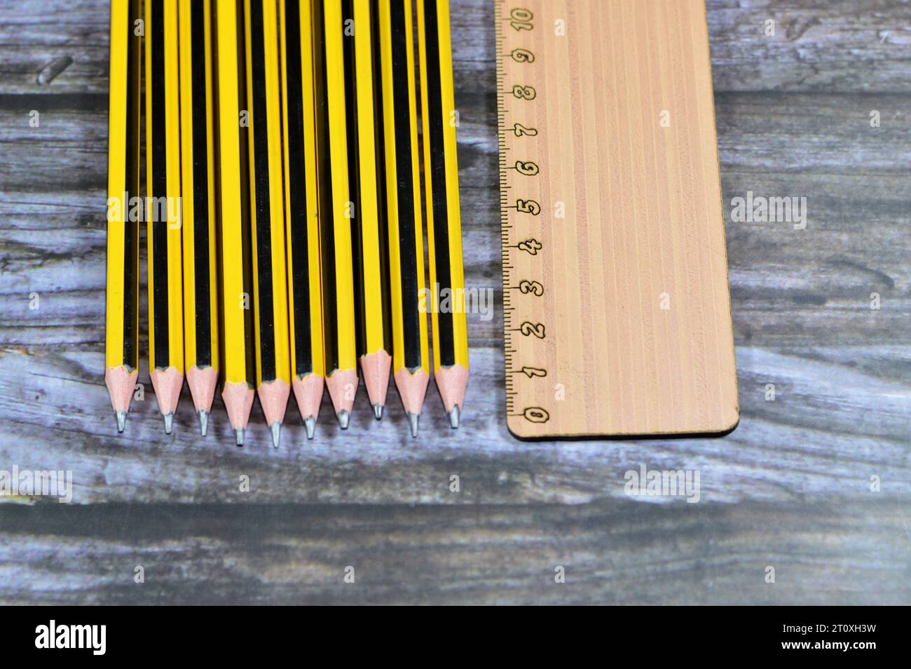 A ruler, rule, line gauge for length measurement and Row of pencils, a ...