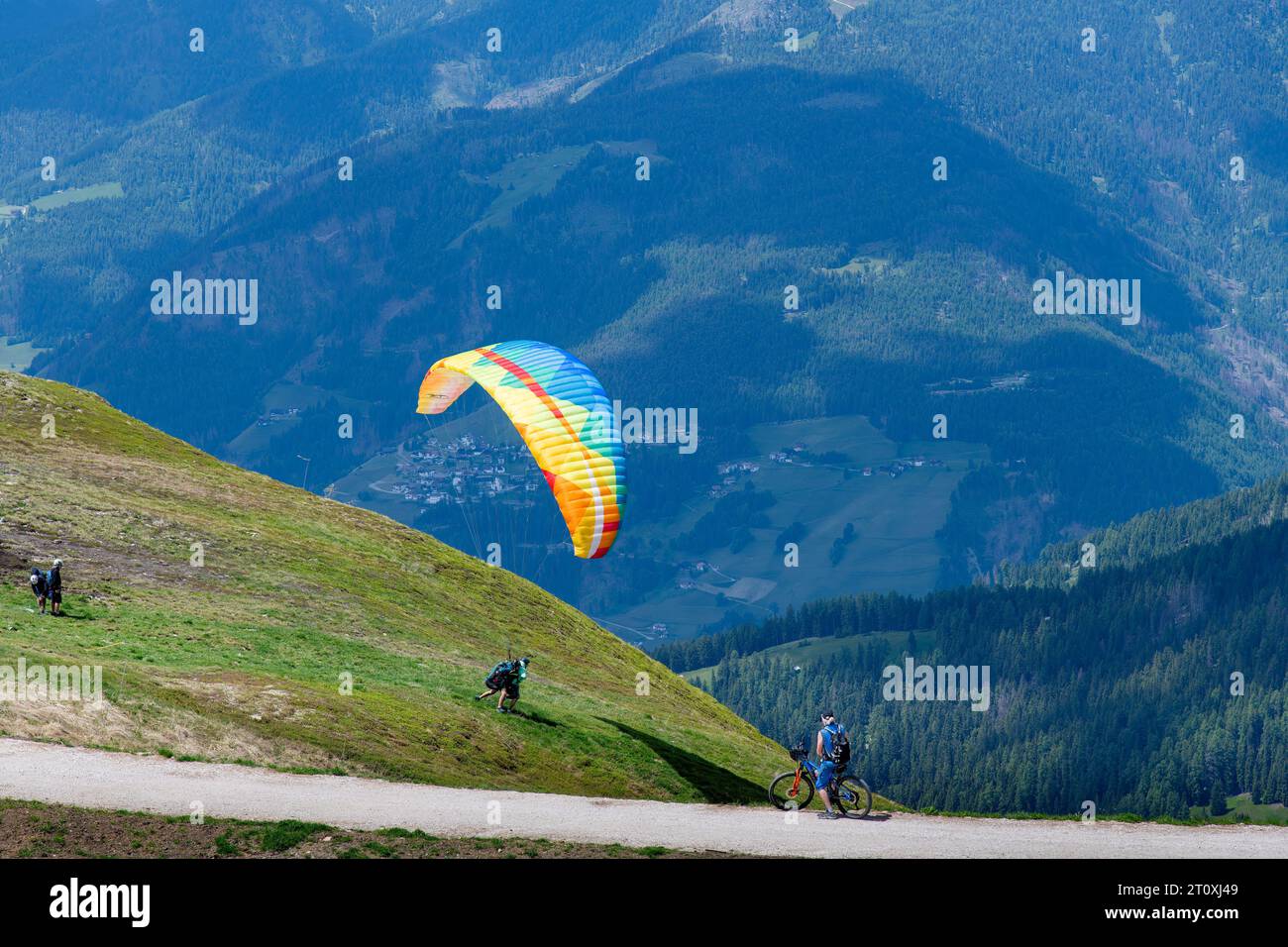 Kronplatz, Italy-June 14, 2023; A tandem paraglide from the summit of ...