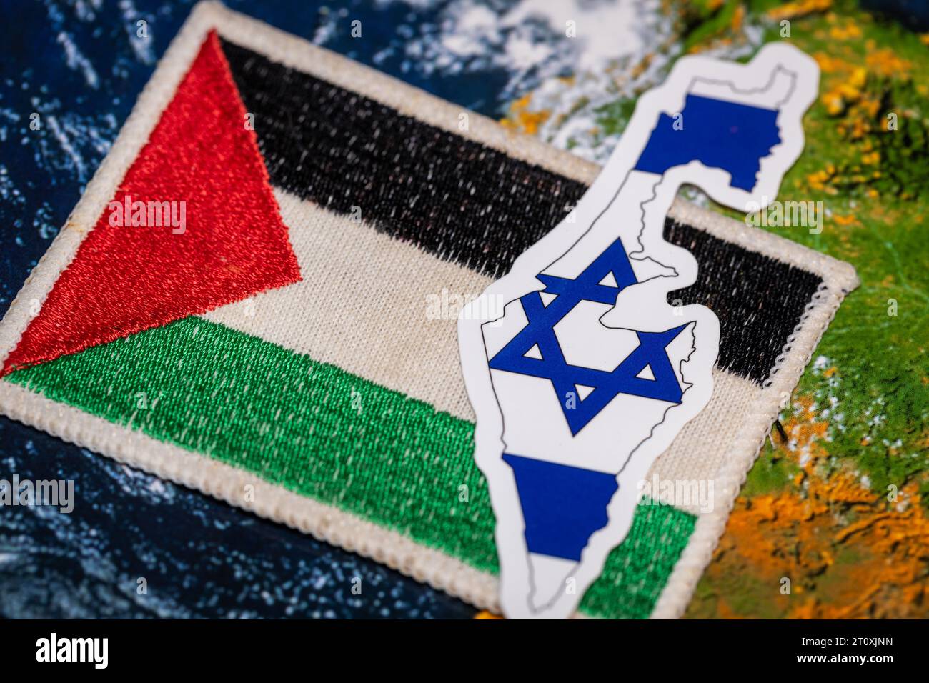 The flag of Israel against the background of the Palestinian flag ...