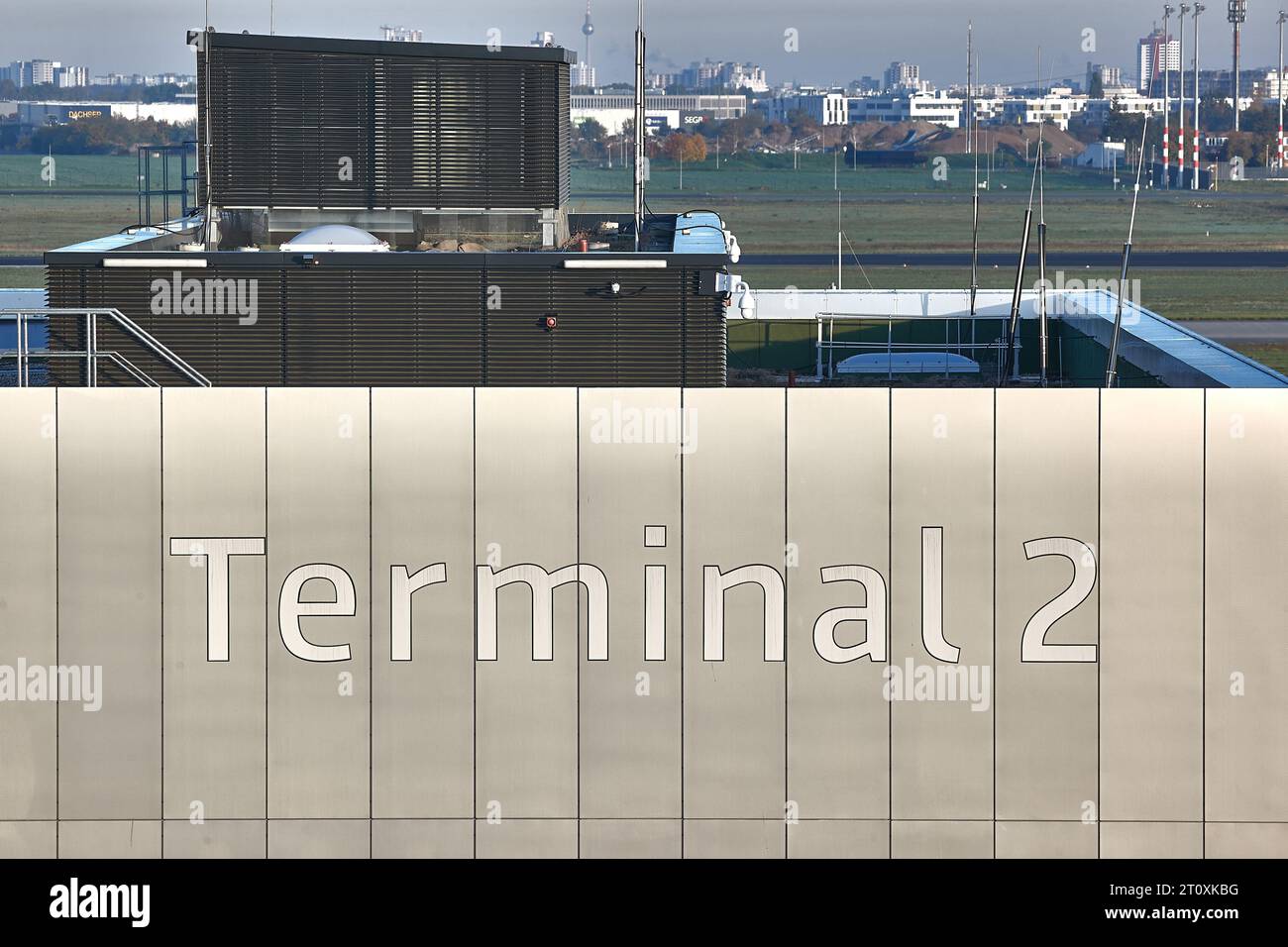 Terminal 2 sign on airport terminal wall Stock Photo - Alamy