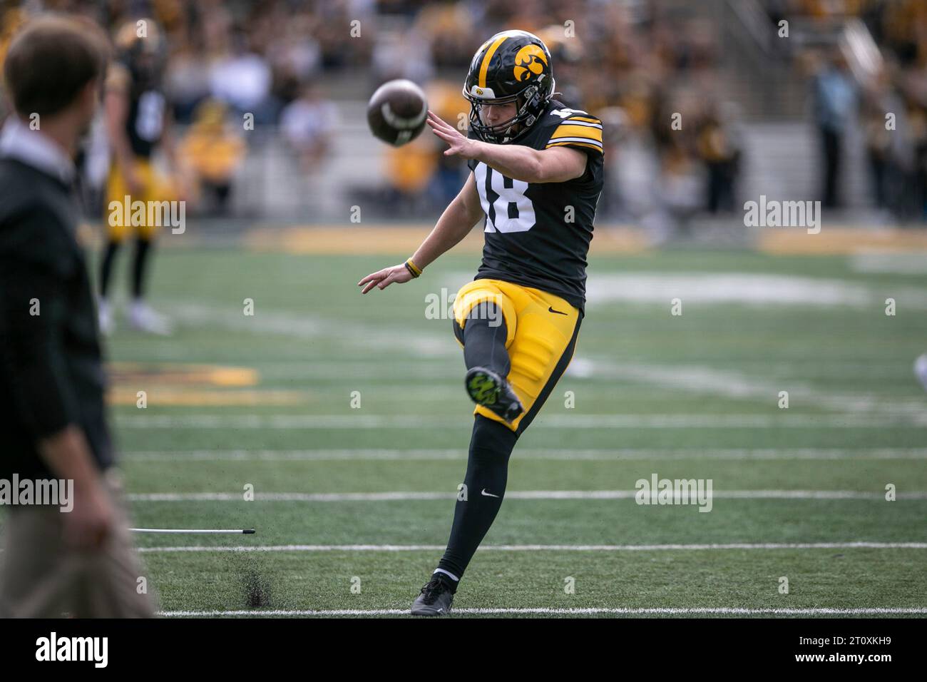 Iowa Hawkeyes place kicker Drew Stevens (18) takes practice kicks ...