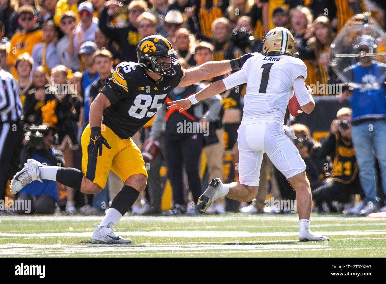 Iowa Hawkeyes defensive lineman Logan Lee (85) brings down Purdue ...