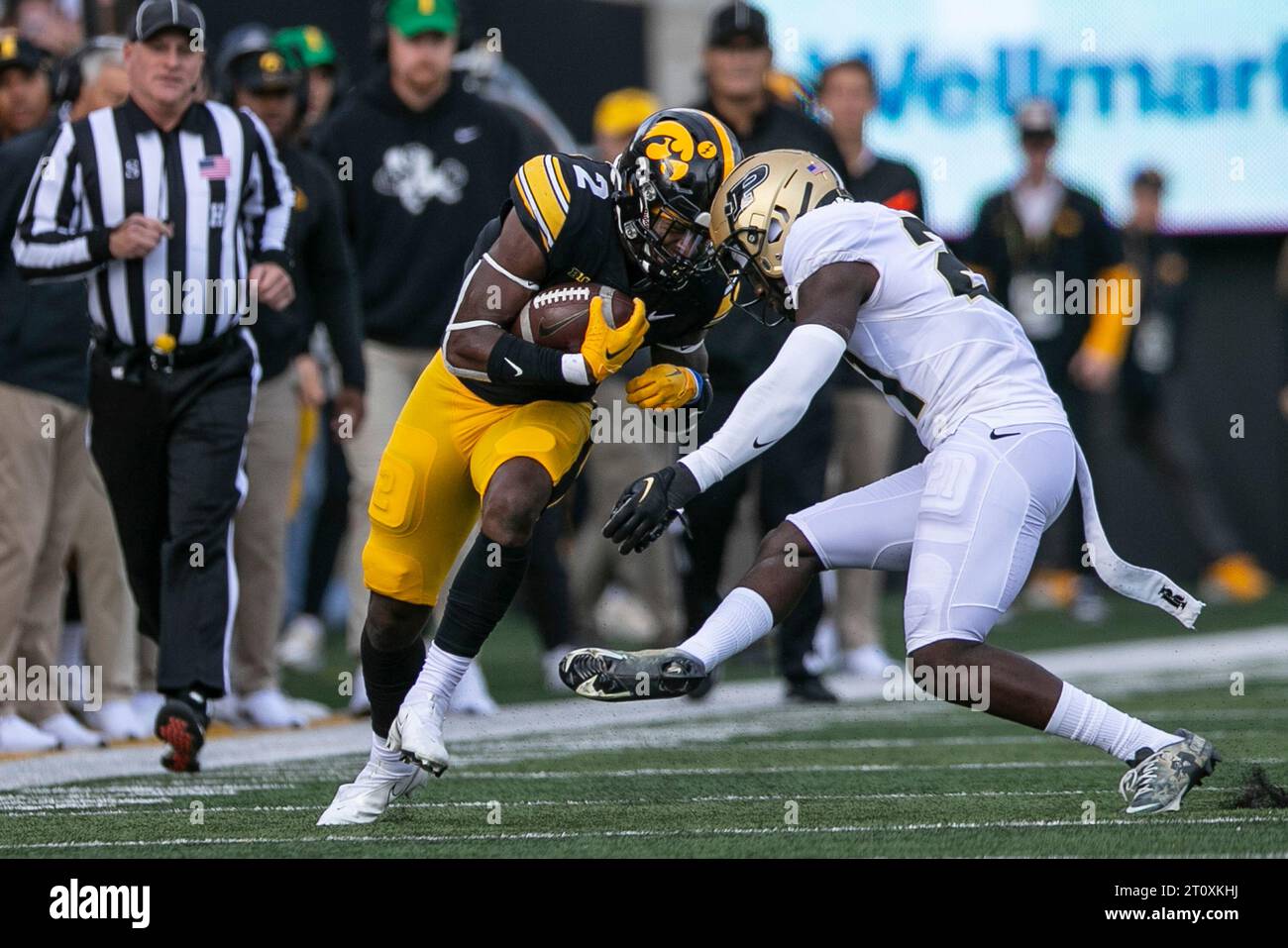 Iowa Hawkeyes running back Kaleb Johnson (2) goes head to head with ...
