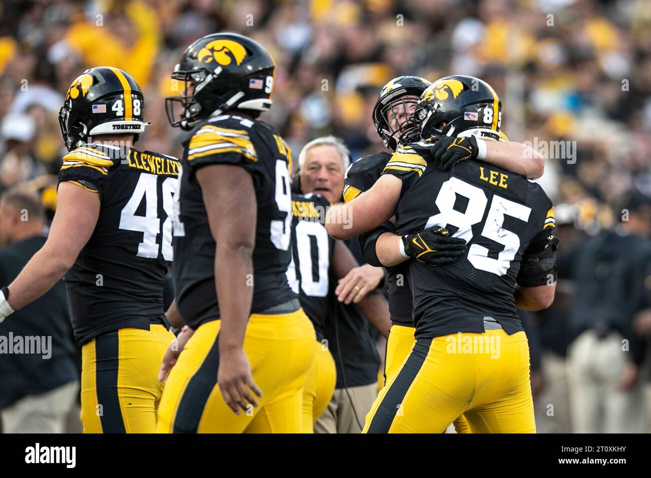 Iowa Hawkeyes defensive lineman Logan Lee (85) is hugged by Iowa ...