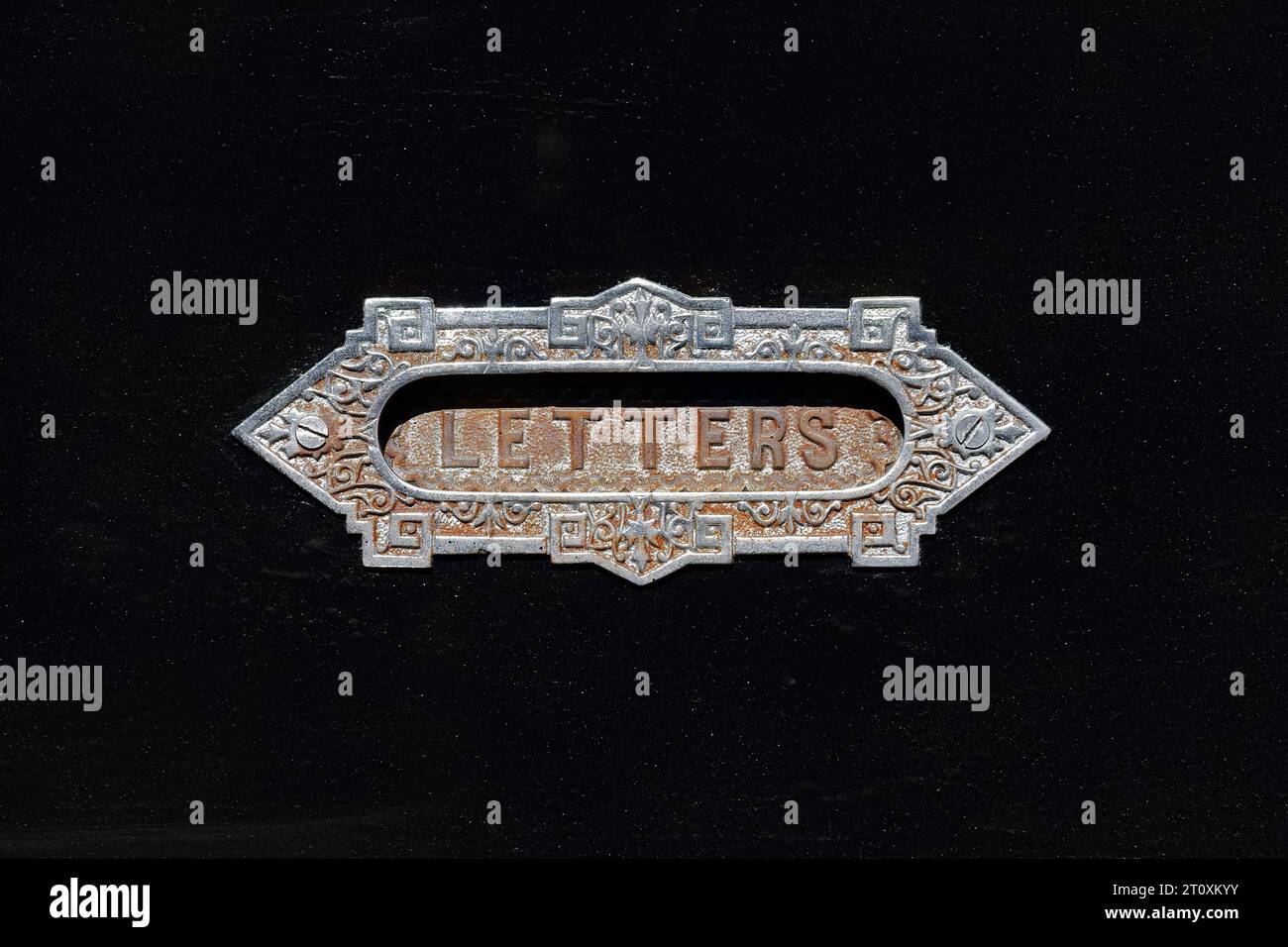 991 Mail slot cut on a black-painted wooden door with the legend ...