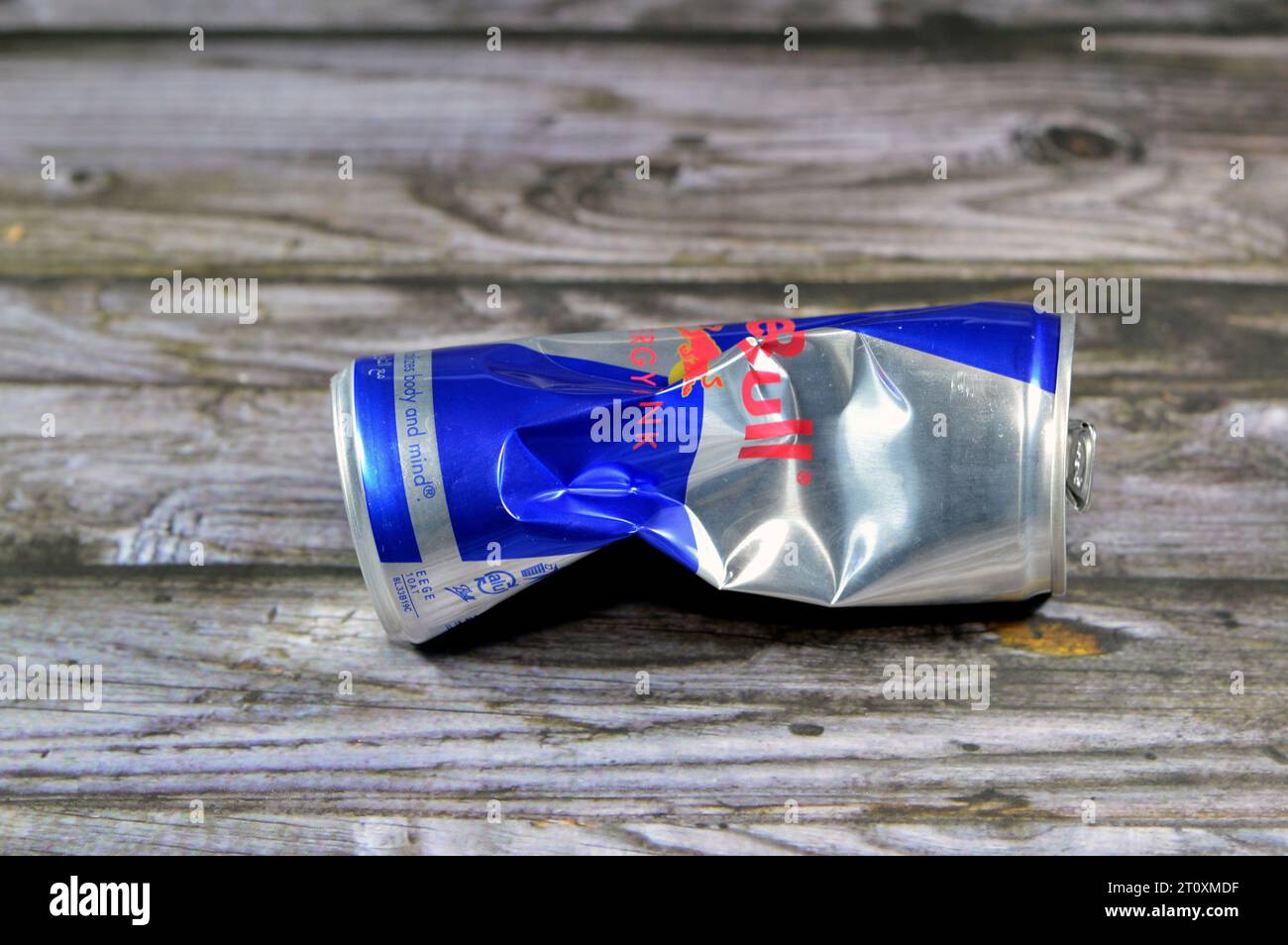 Cairo, Egypt, October 1 2023: Crushed dented Red Bull energy drink, a ...