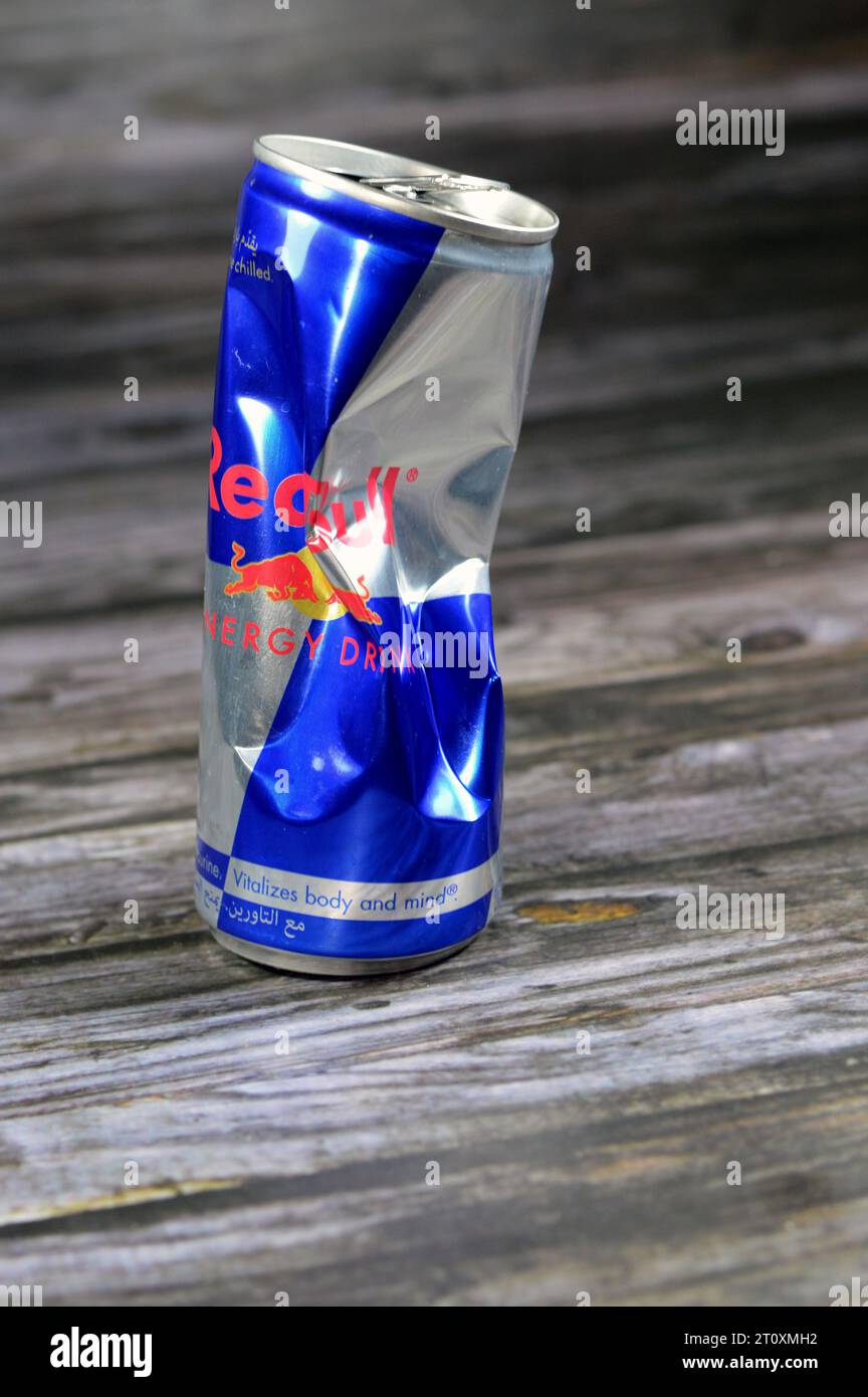 Cairo, Egypt, October 1 2023: Crushed dented Red Bull energy drink, a ...