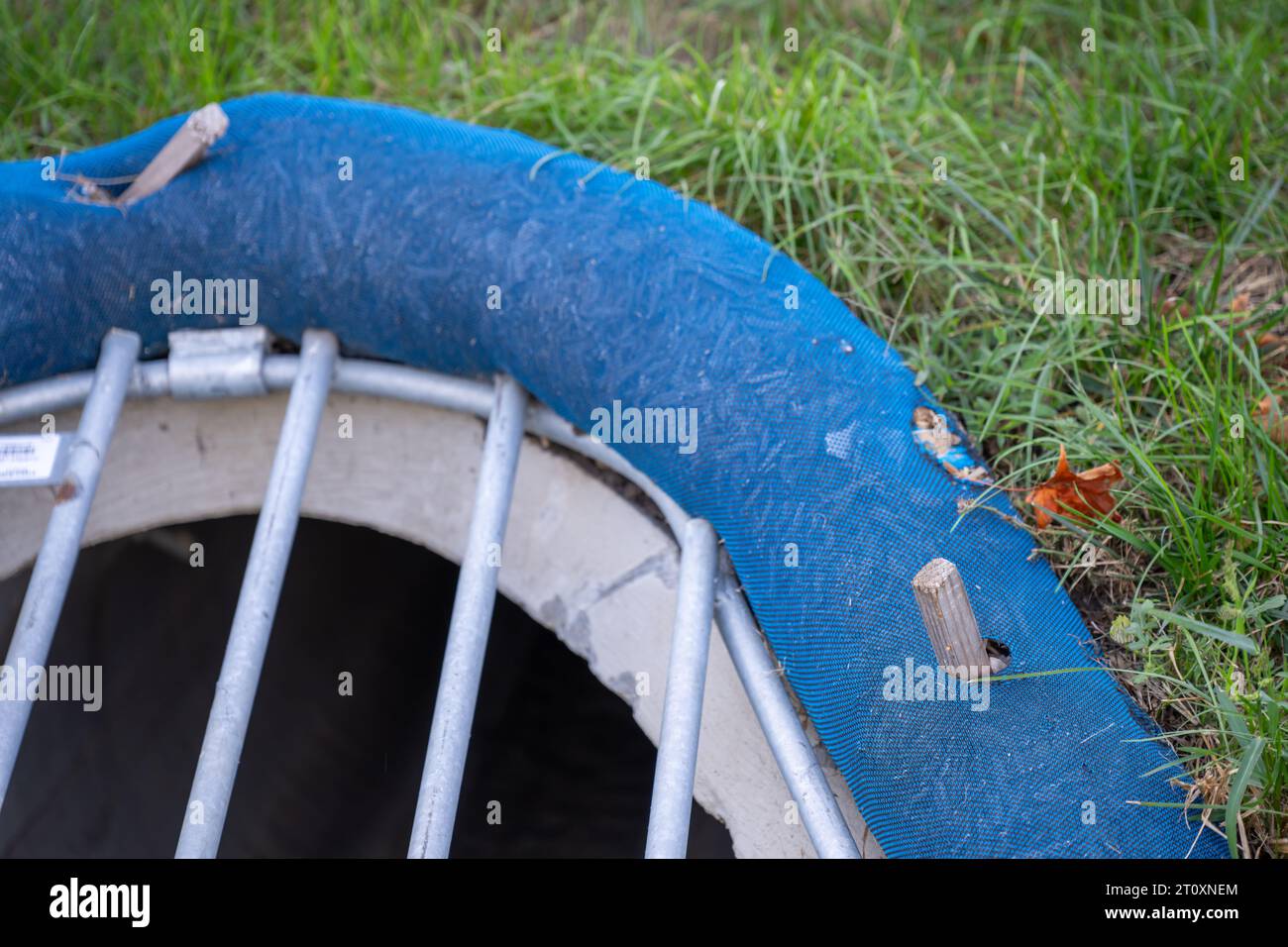 Filter sock staked around a storm intake grating Stock Photo - Alamy