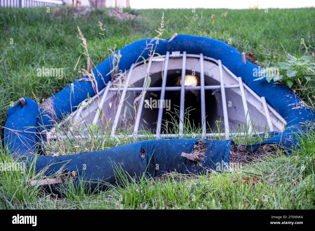 Filter sock staked around a storm intake grating Stock Photo - Alamy