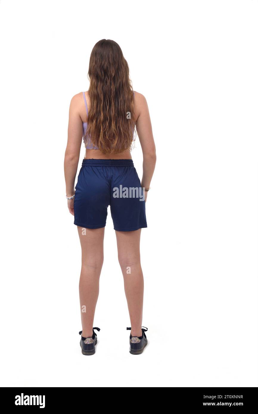 back view of a young girl standing on white background Stock Photo - Alamy