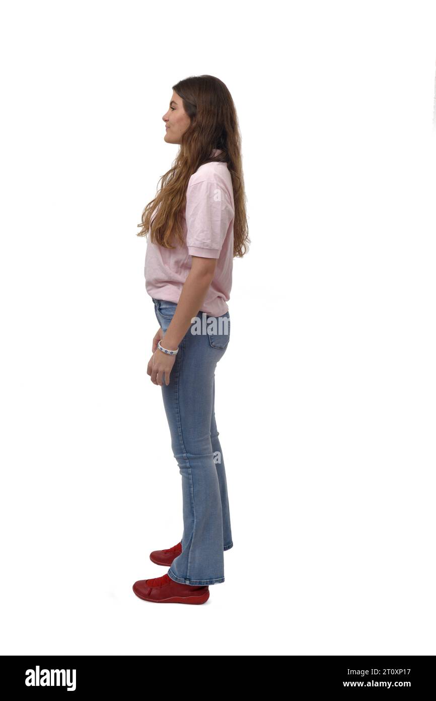 side view of a young girl standing on white background Stock Photo - Alamy