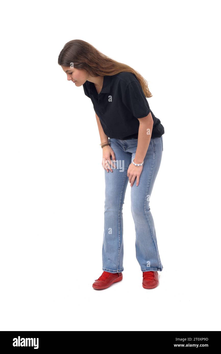 young girl crouching and looking the floor on white background Stock ...