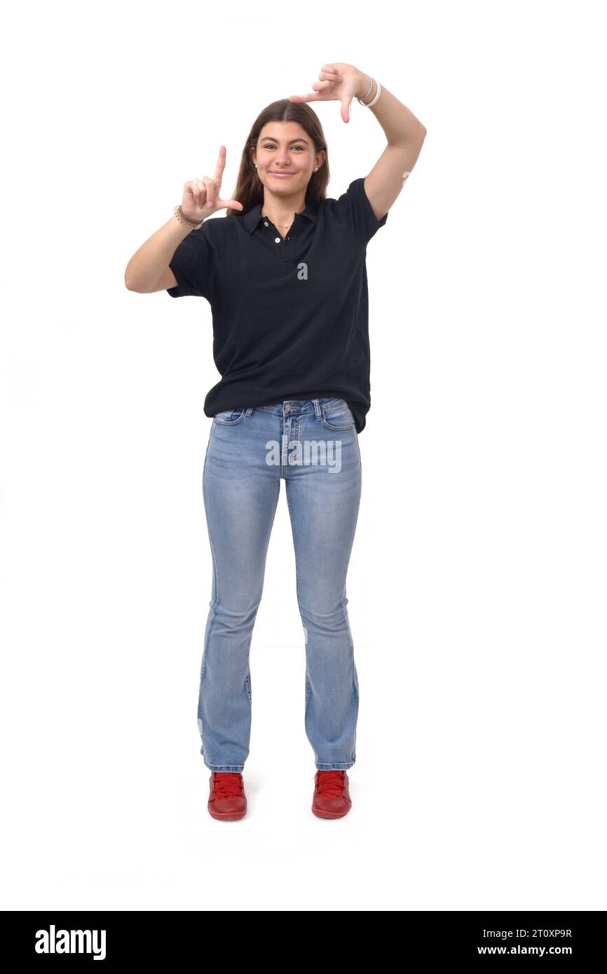 front view of a young girl framing with his hands on white background ...