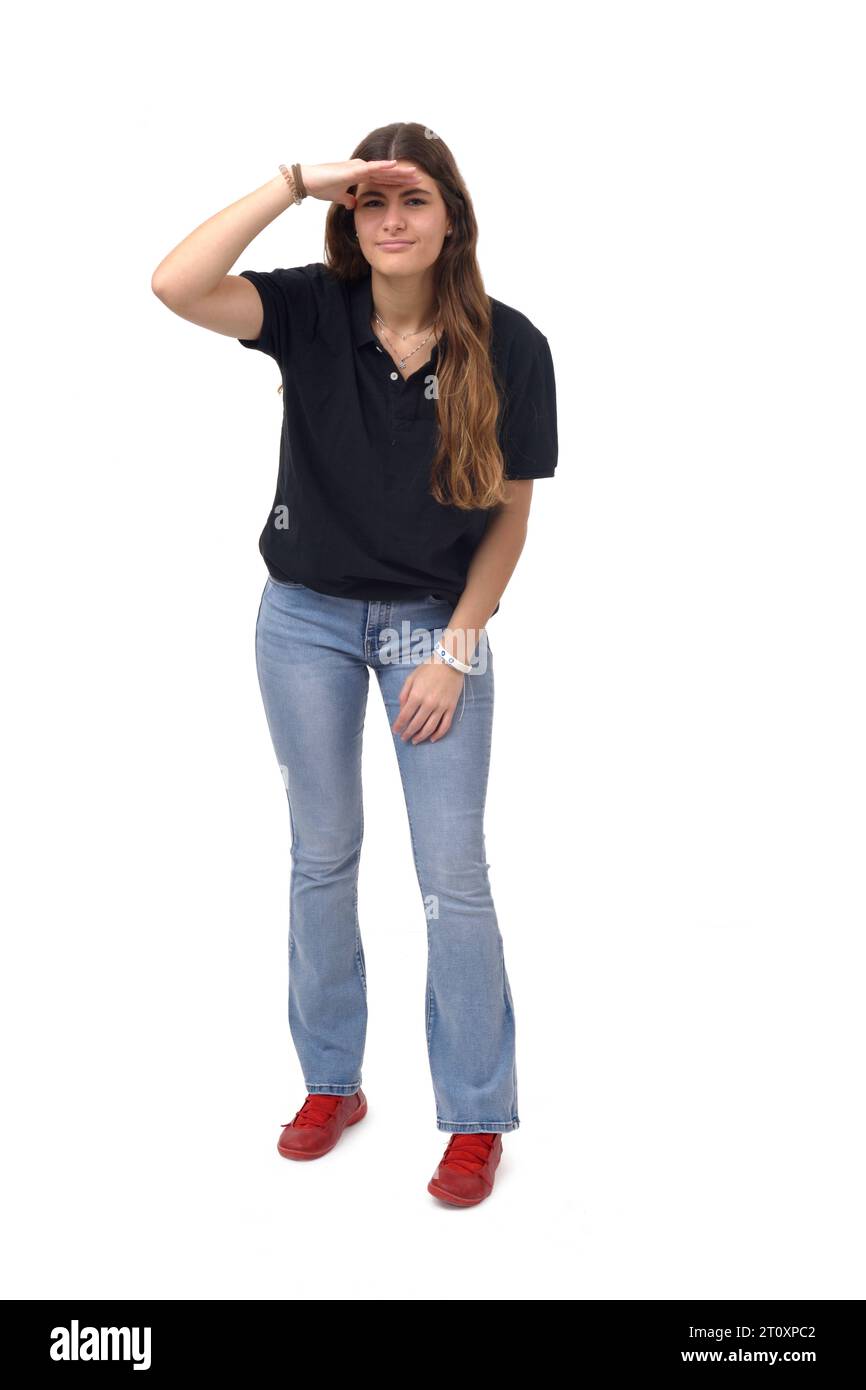 front view of young girl hand on forehead looking away on white ...