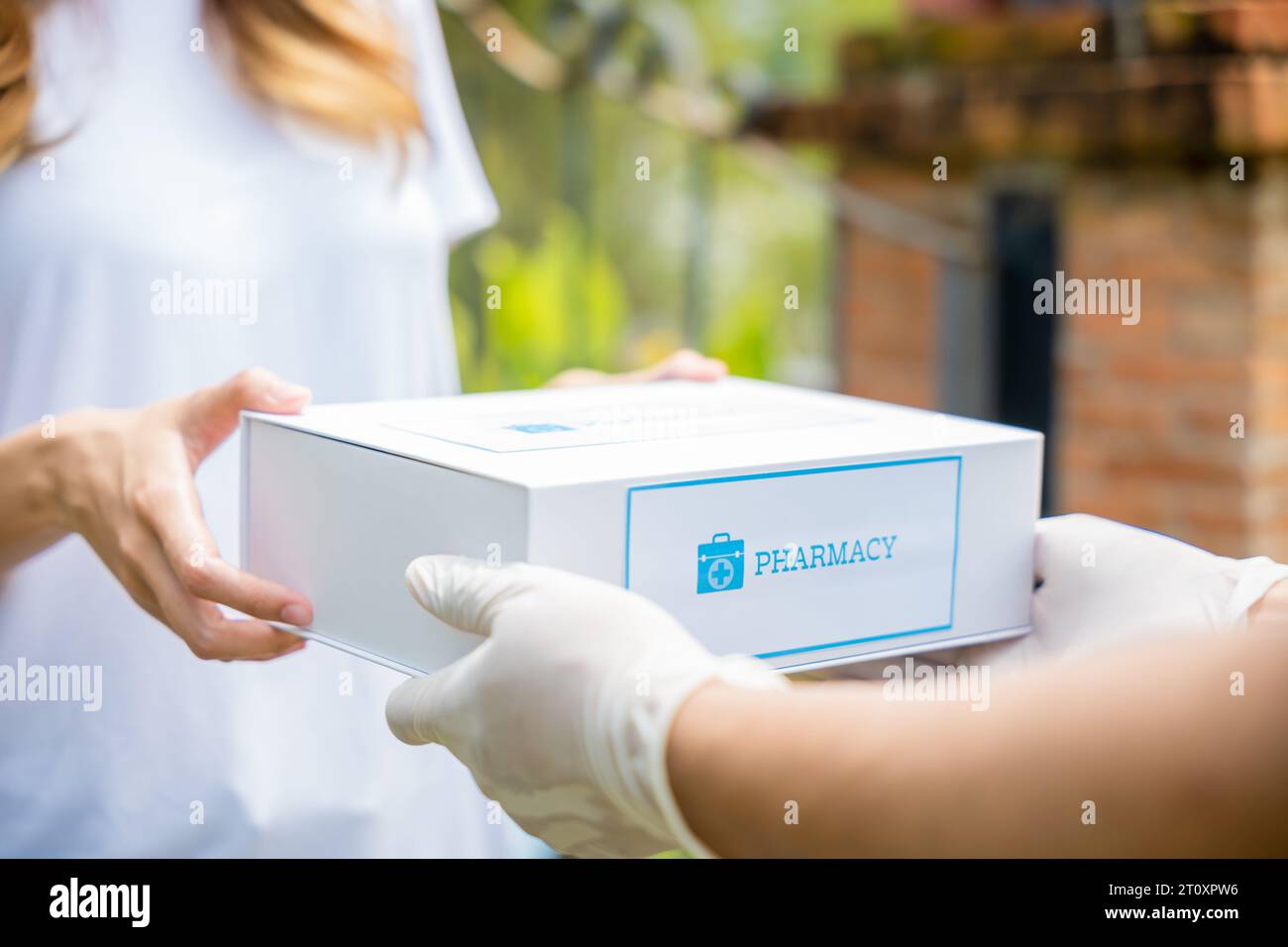 Sick Asian young woman receive medicine first aid pharmacy box from ...