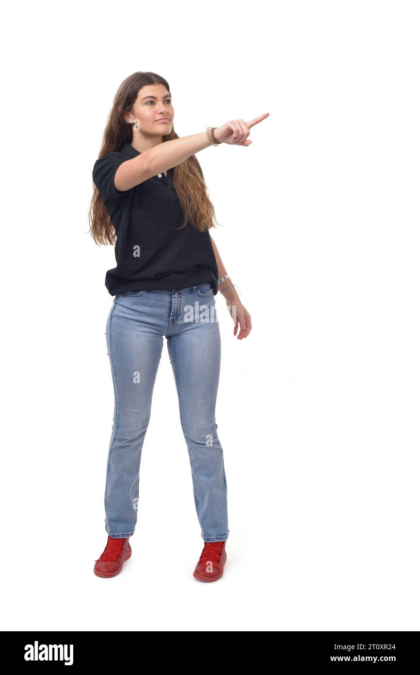 youg girl front view of a girl pointing to the side on white background ...