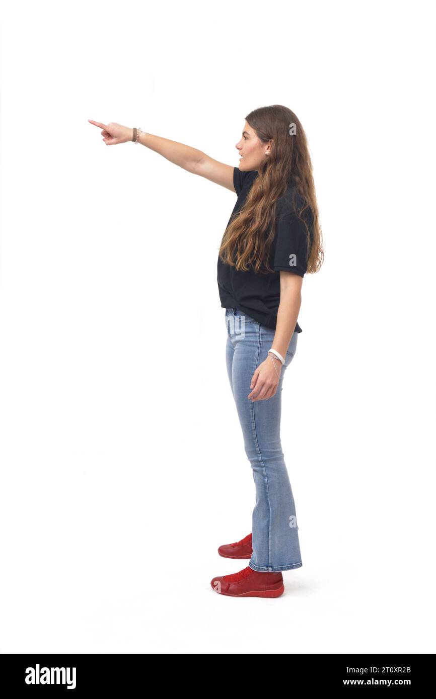 side view of yung girl pointing on white background Stock Photo - Alamy