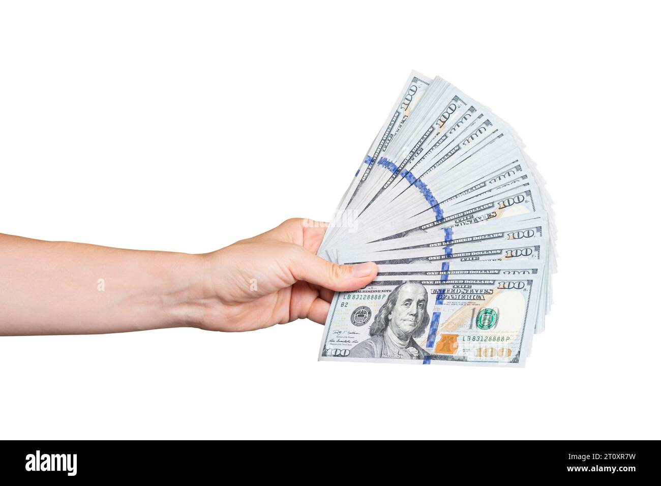 Hand holding a big stack of banknotes isolated on a white background ...
