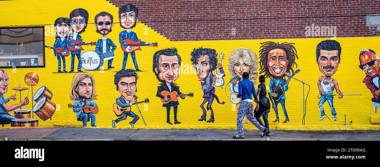 A pair of young boys checks out the new mural on Cedar Street in ...