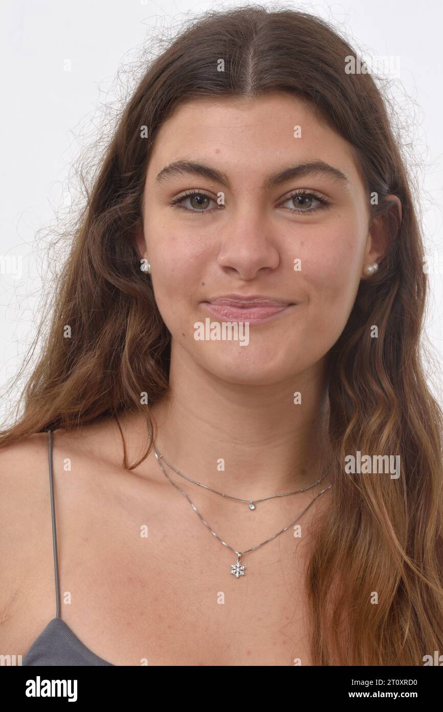 front view portrait of a young girl looking at camera on white ...