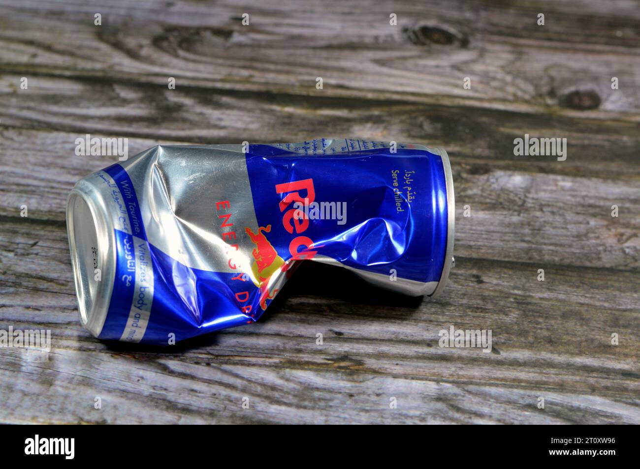Cairo, Egypt, October 1 2023: Crushed dented Red Bull energy drink, a ...