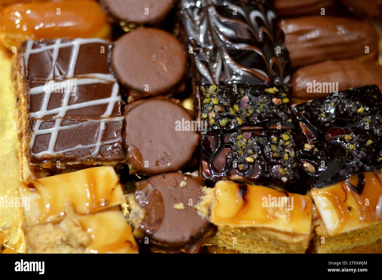 Assorted mini small gateau pieces with various toppings and stuffed ...