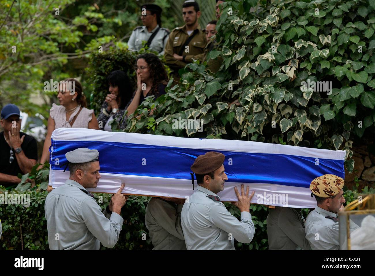 FILE - Israeli soldiers carry the flag-covered coffin of Col. Roi Levy ...
