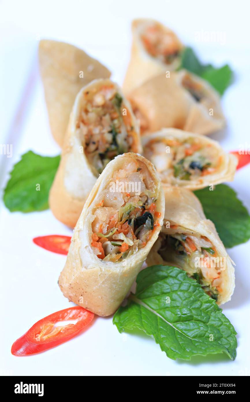 Crispy prawn spring rolls / Crispy prawn spring rolls on white plate ...