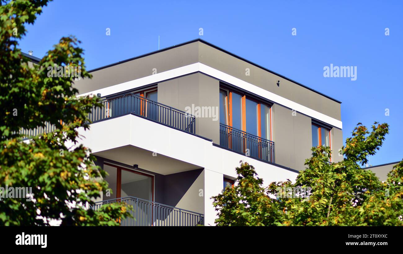 Green community. Eco apartment building saving energy and fresh air ...