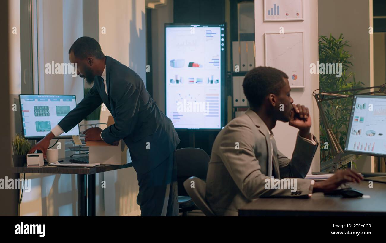 Coworker consolling employee leaving workplace hi-res stock photography ...
