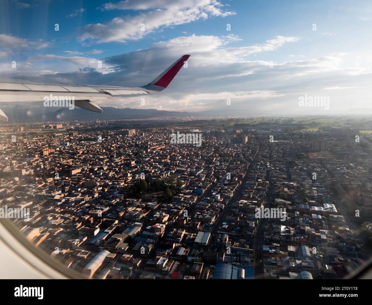 view thru the window of a passanger jet airplane taking off from Bogotá ...