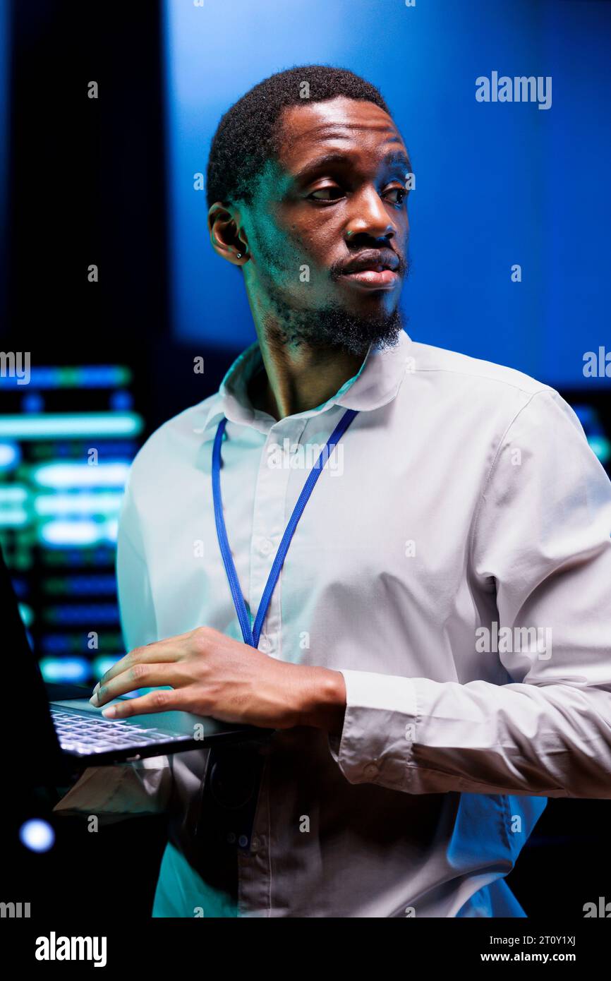 African american expert troubleshooting server farm providing vast ...