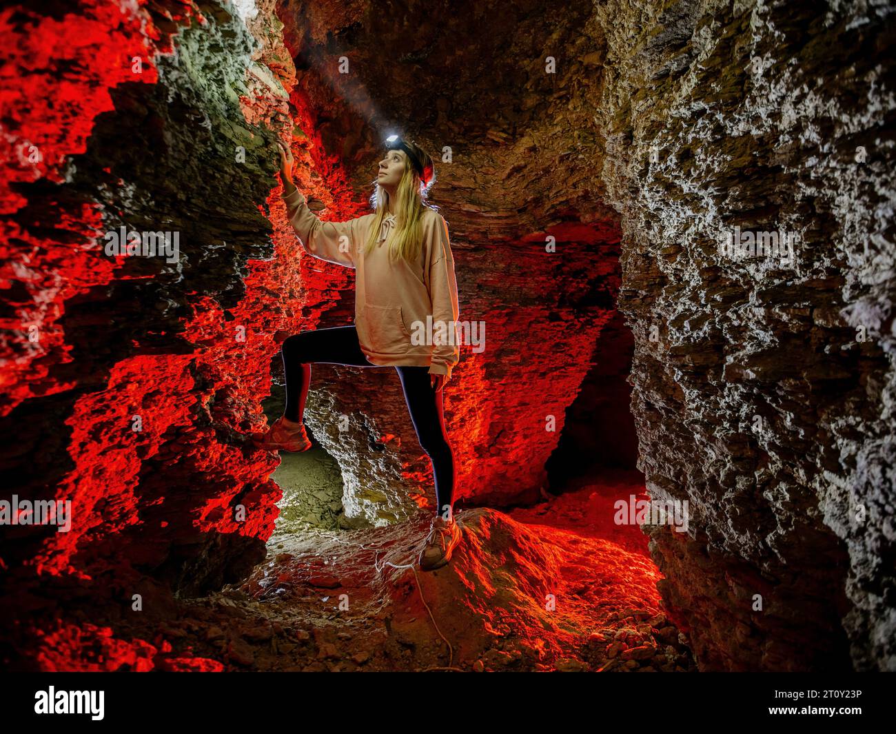 Girl with flashlight explores dark creepy abandoned underground ...