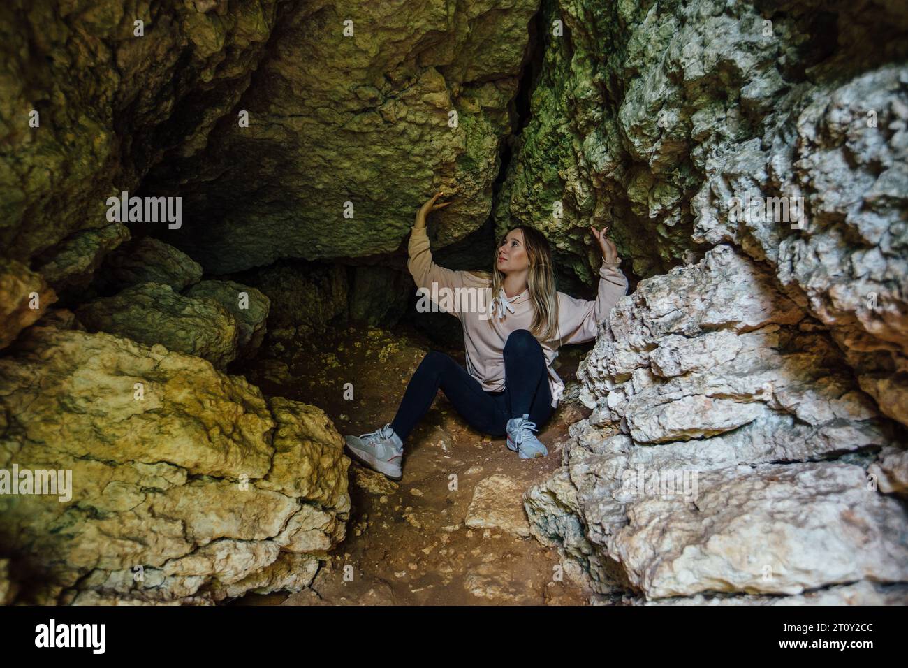 Girl with explores underground limestone cave Stock Photo - Alamy