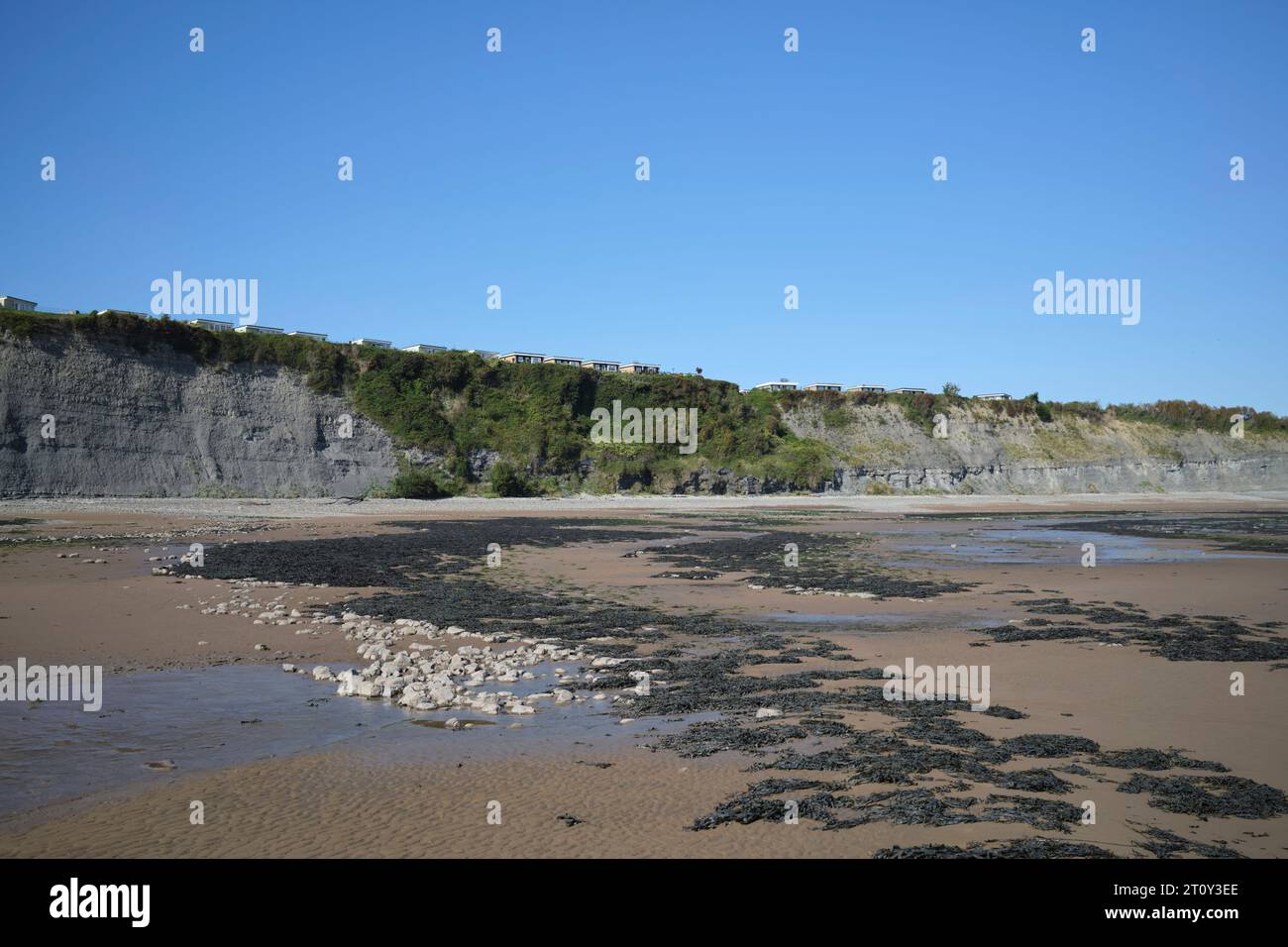 Cliff Face in St Marys Well Bay with Caravan Park Chalet just in view ...