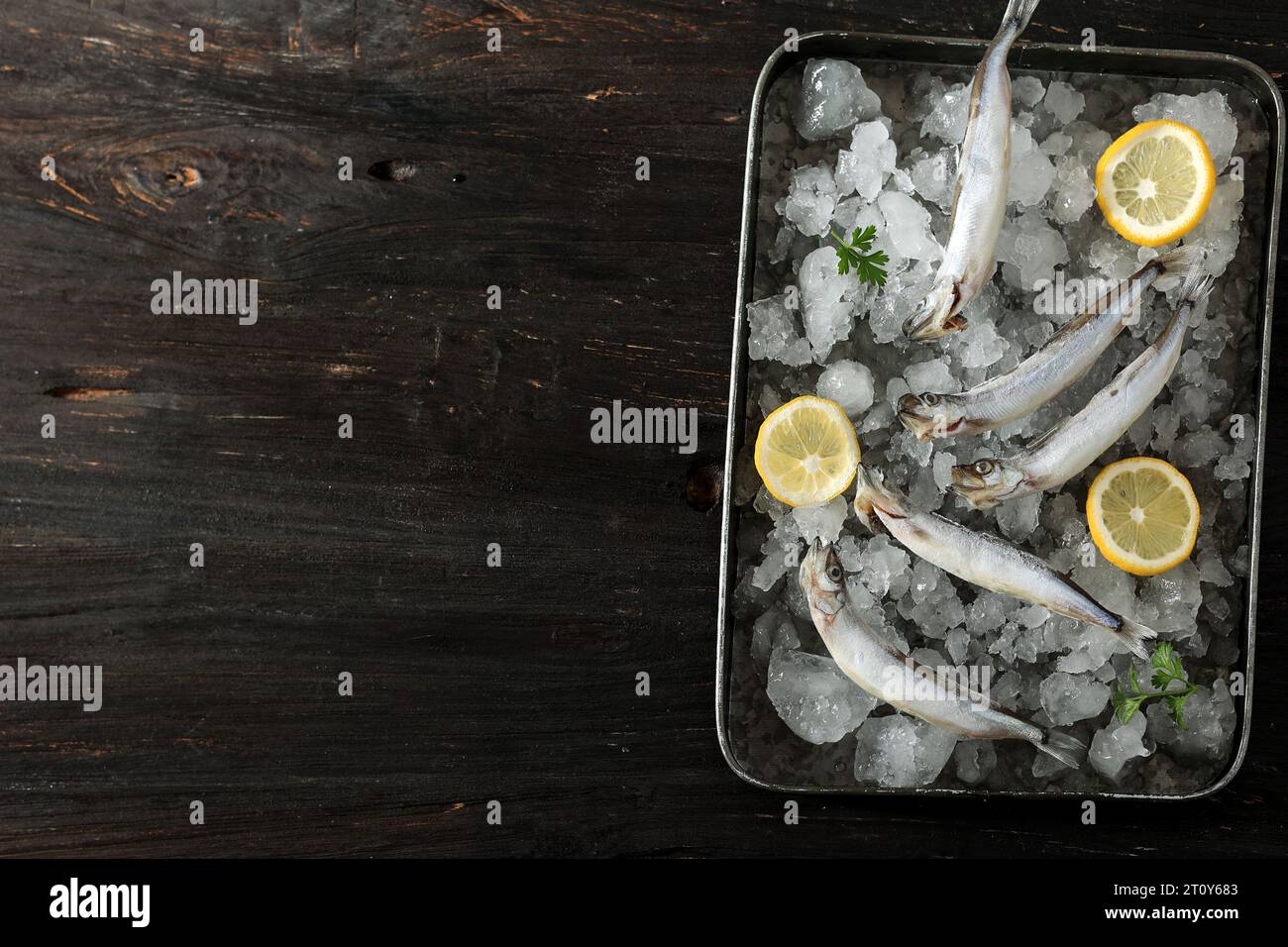 Frozen Capelin Shisamo Fish on Wooden Table, Top View. Copy Space for ...