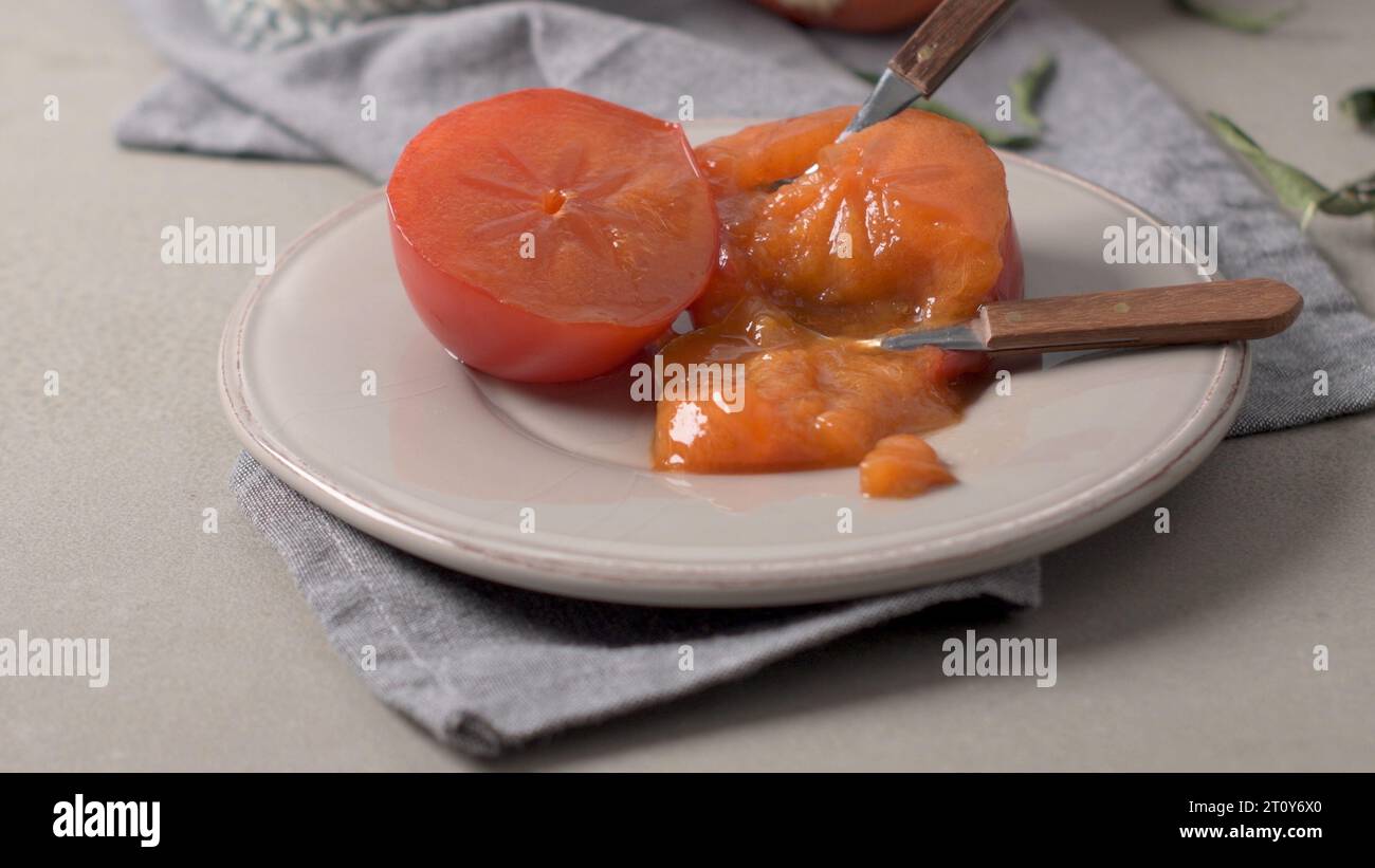Persimmon fruit on rustic table in vintage style Stock Photo - Alamy