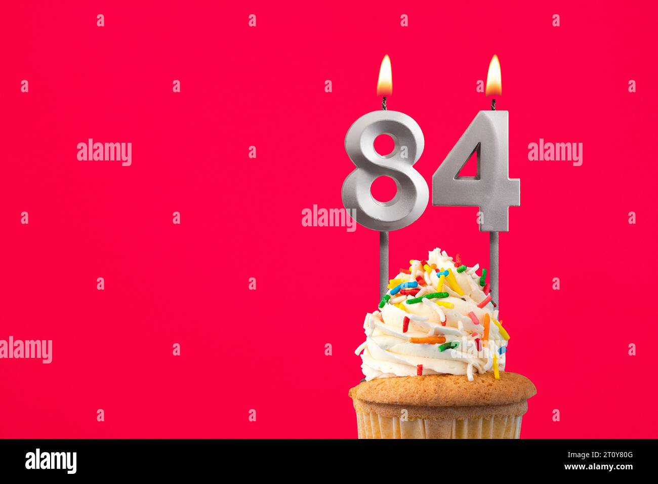 Burning candle number 84 - Birthday card with cake Stock Photo - Alamy