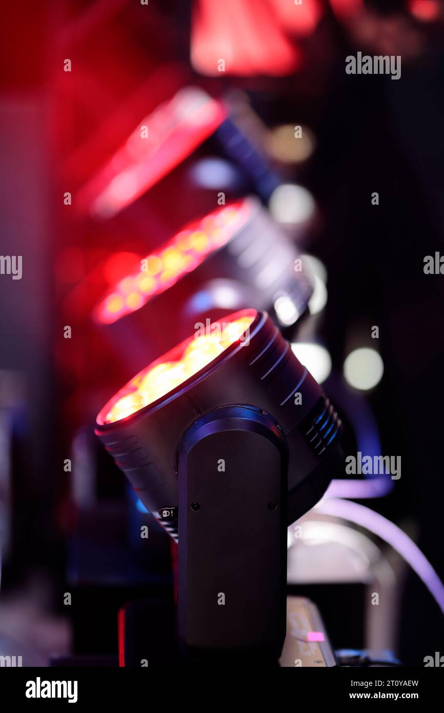 Stage RGBW LED beam moving head lights. Red light. Selective focus ...
